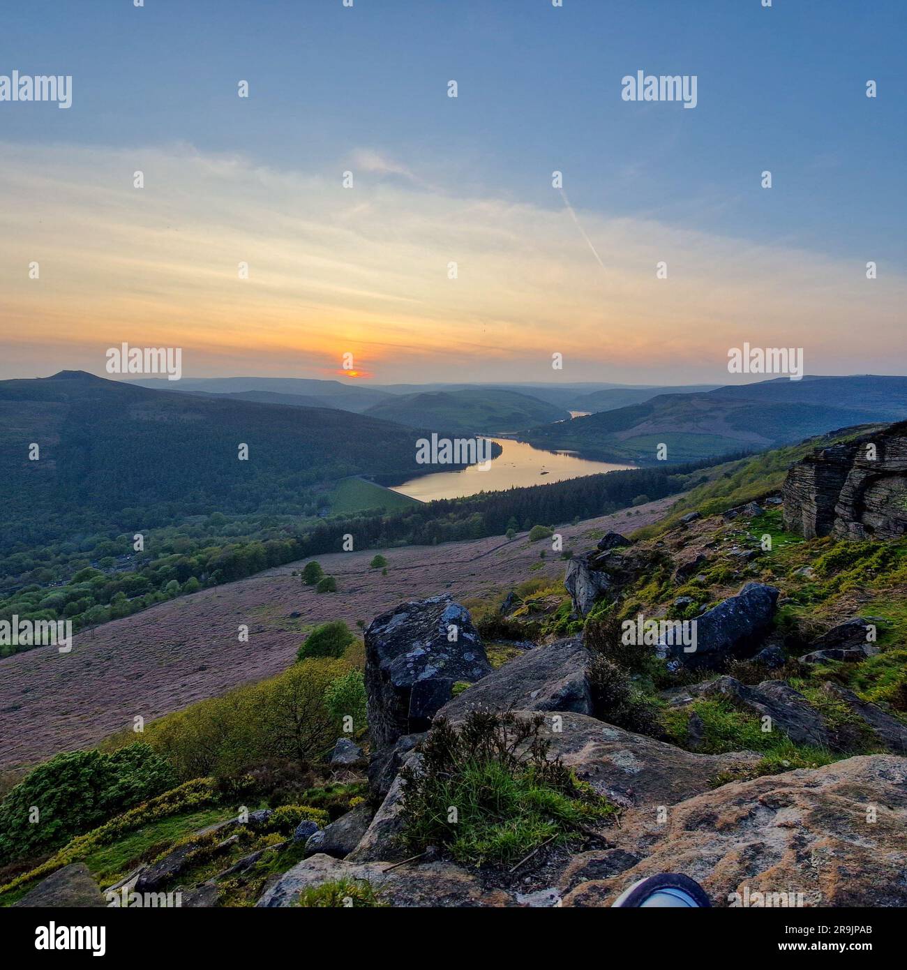 The photo shows a sunset at Bamford Edge in the Peak District. The sky ...