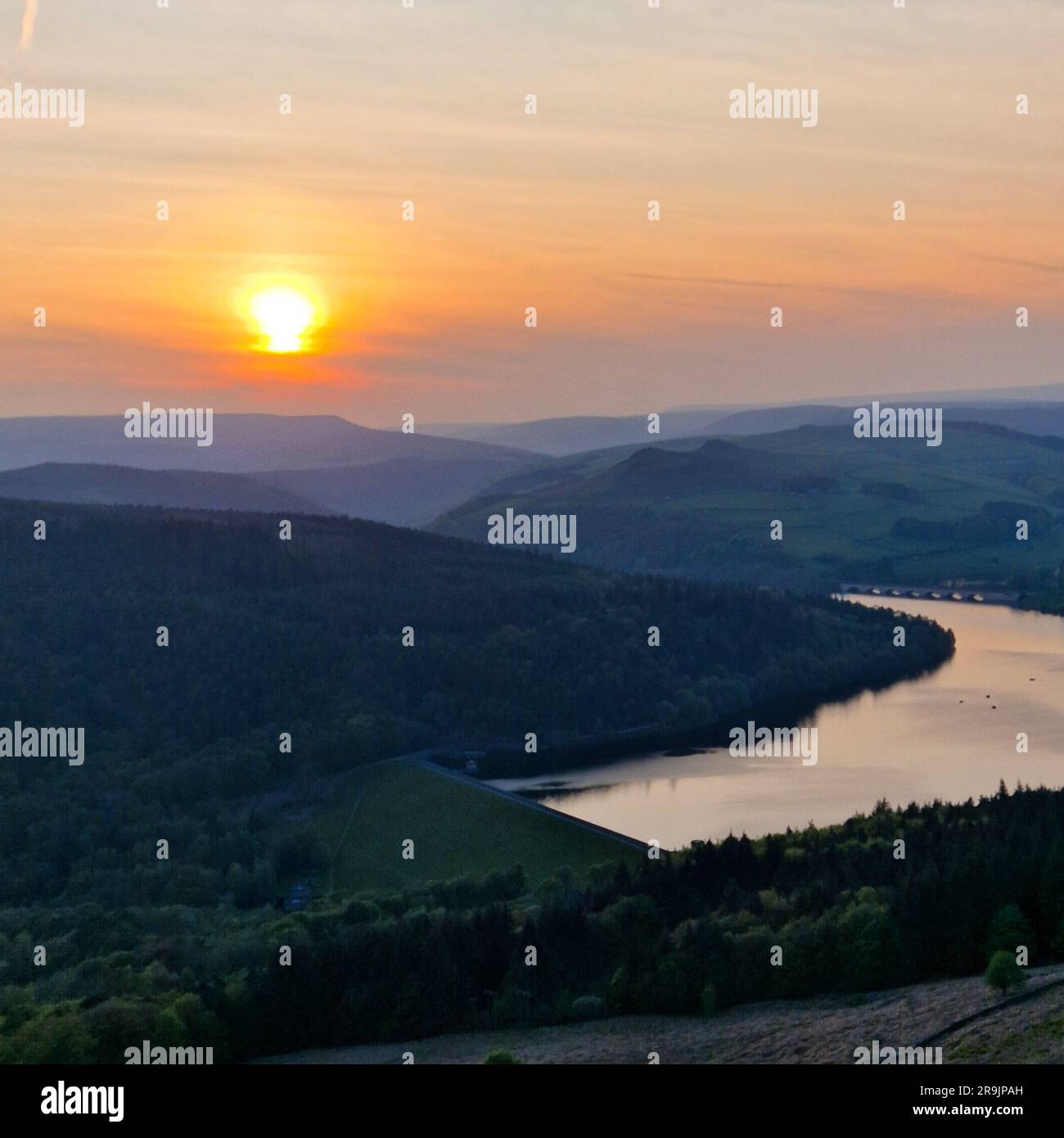 The photo shows a sunset at Bamford Edge in the Peak District. The sky ...