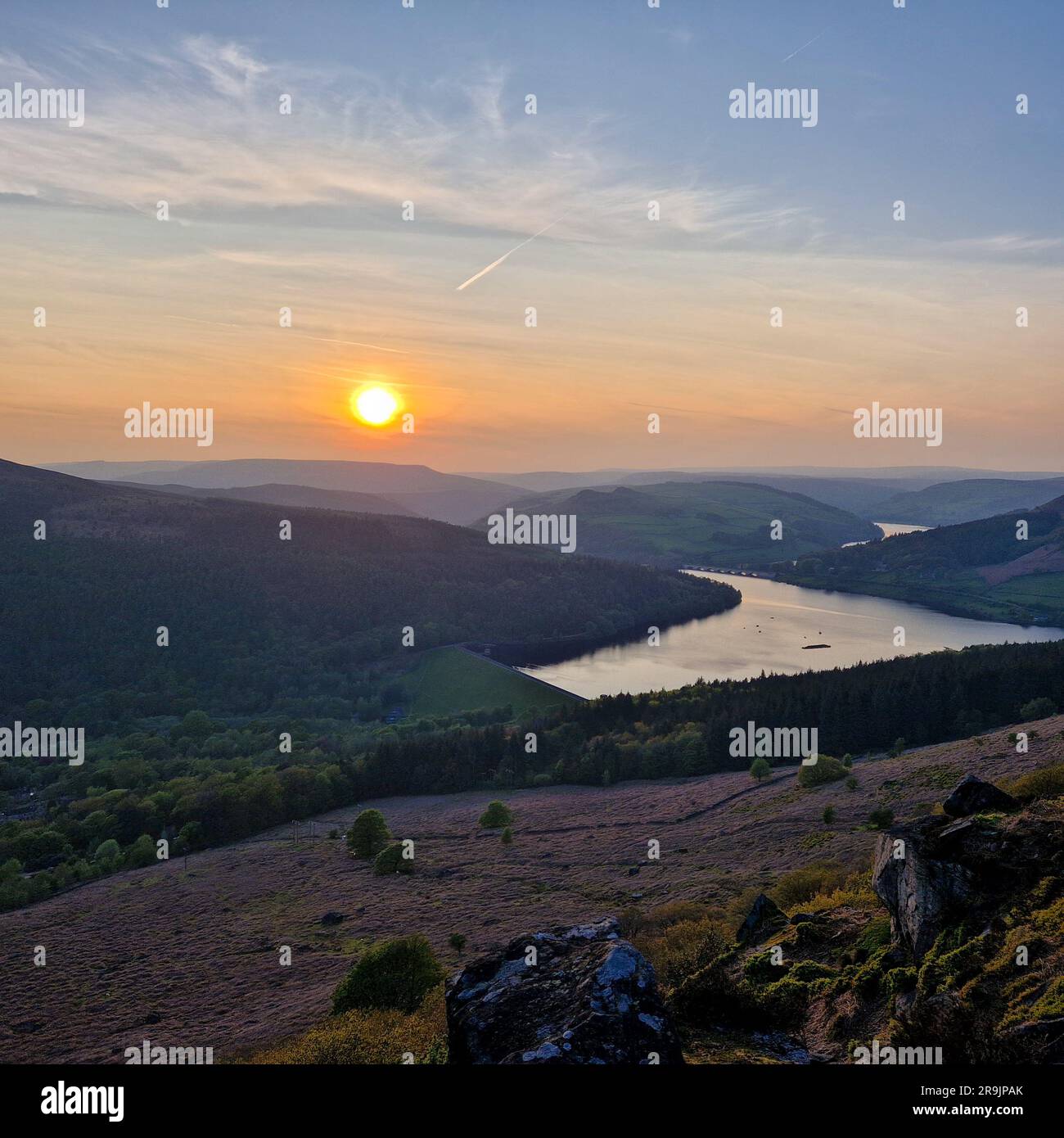 The photo shows a sunset at Bamford Edge in the Peak District. The sky ...