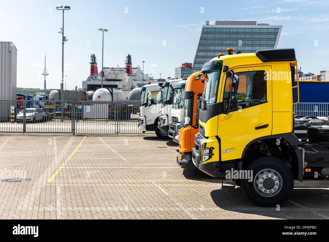 Side view many new heavy commercial cargo transport vehicles stand at ...