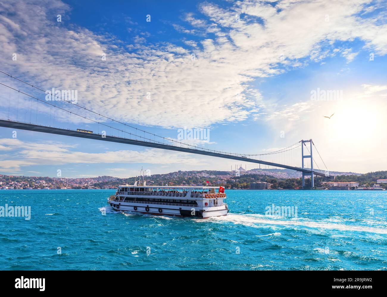 Ship is sailing near the Bosphorus bridge and modern Istanbul view ...