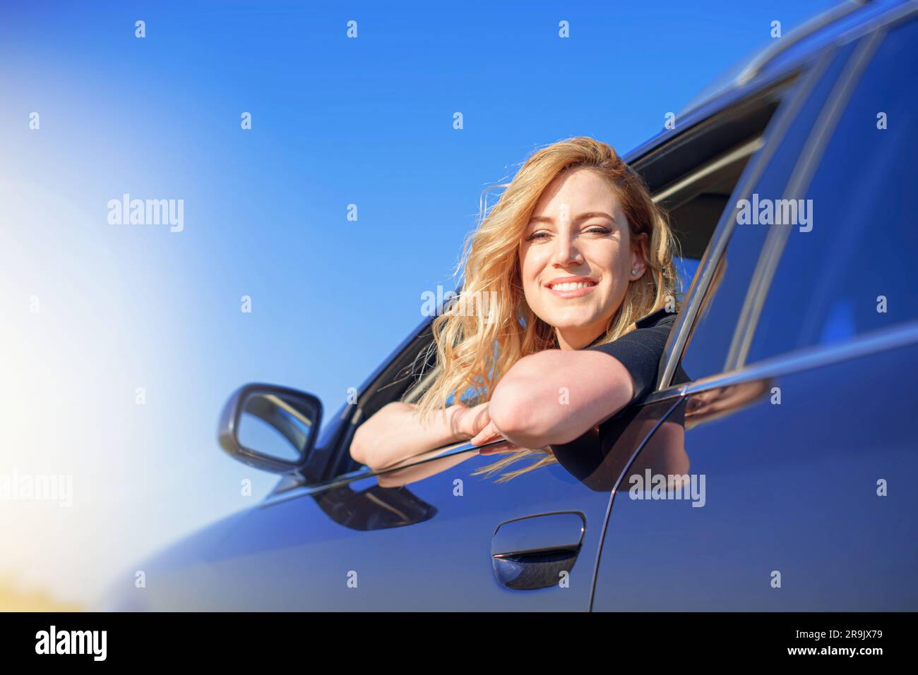 Blonde white woman inside car hi-res stock photography and images - Alamy