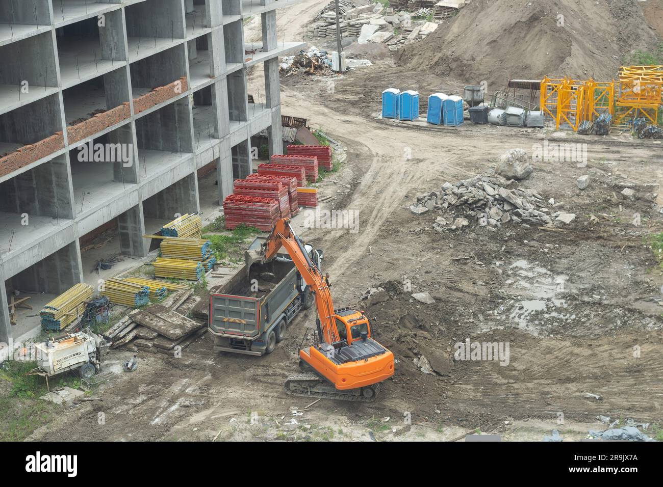 Aerial view Hydraulic scissors on rigging to cut abandoned buildings ...