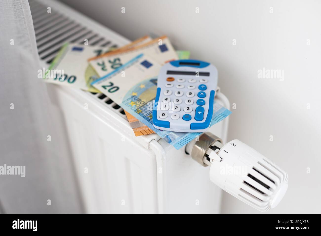 Energy efficiency concept with radiator and euro currency the cost of ...