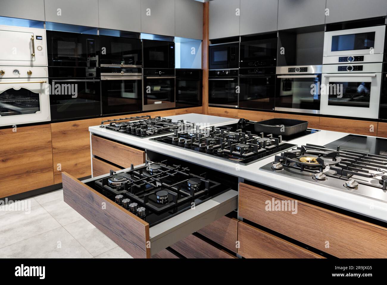 Modern cooking stoves on display in the store Stock Photo - Alamy
