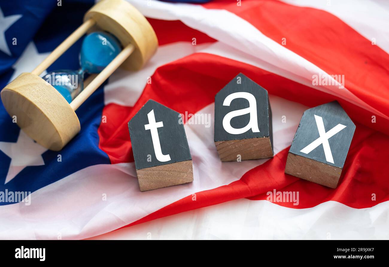 USA flag, gavel and cubes with word tax as a symbol of avoidance or ...