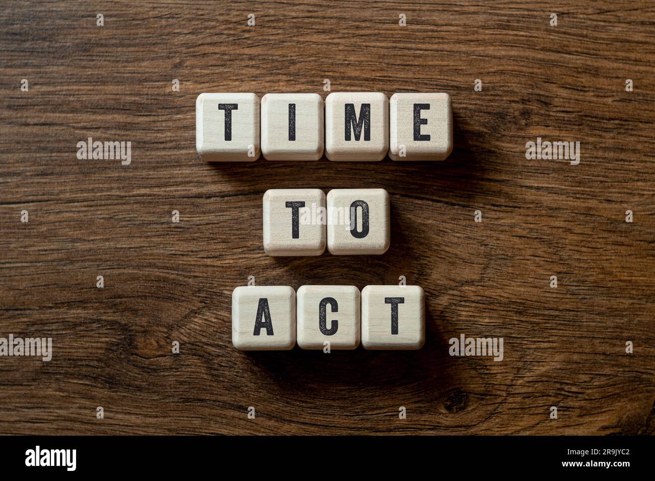 Time to act - word concept on building blocks, text, letters Stock ...