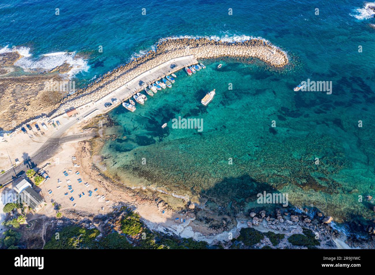 An aerial view of the Peyia Pier in Cyprus, featuring the stunning ...
