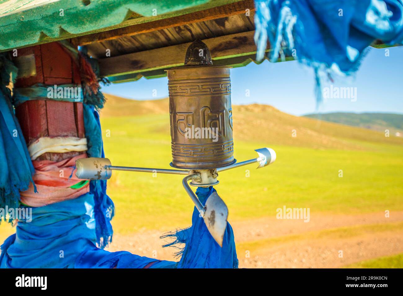 Wind blown prayer wheels Stock Photo - Alamy