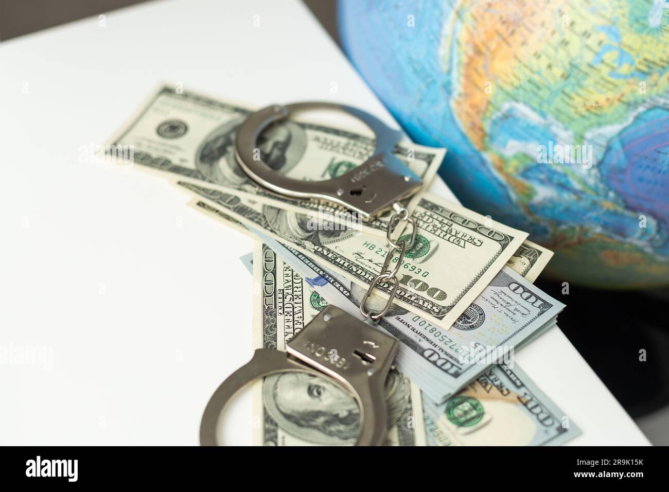 Map of world and Russia with pair of metal handcuffs. Arrest in Russian ...