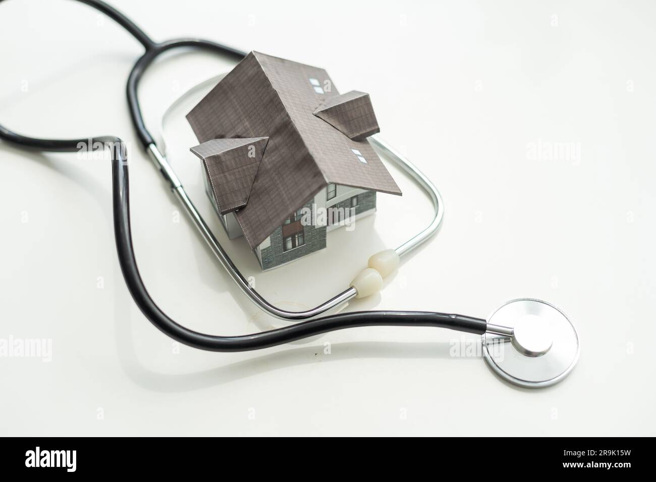 Miniature house and Medical stethoscope Stock Photo - Alamy