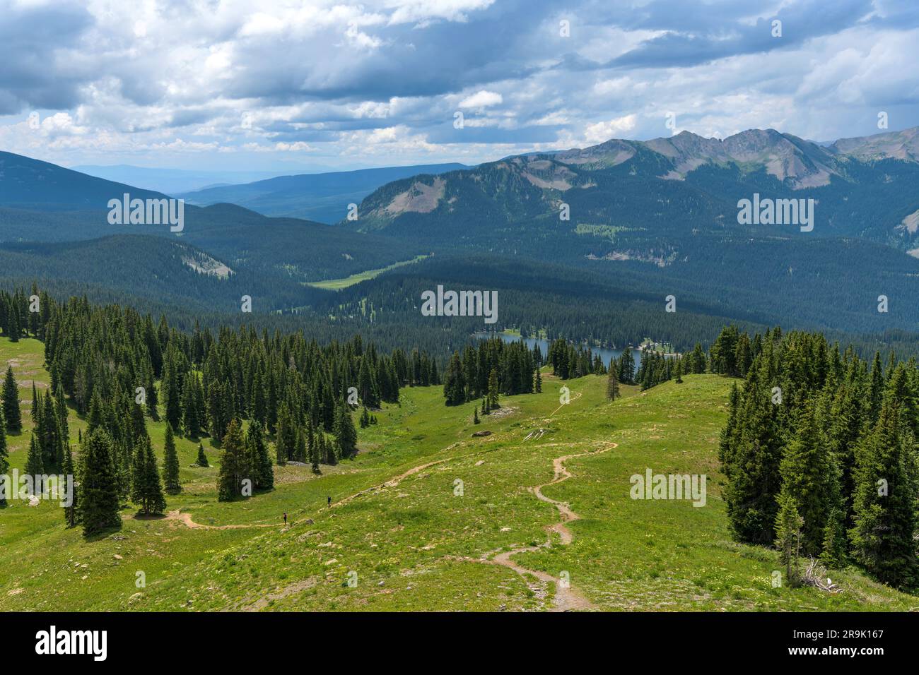 Summer Mountain Trail - A stormy Summer day view of a steep mountain ...