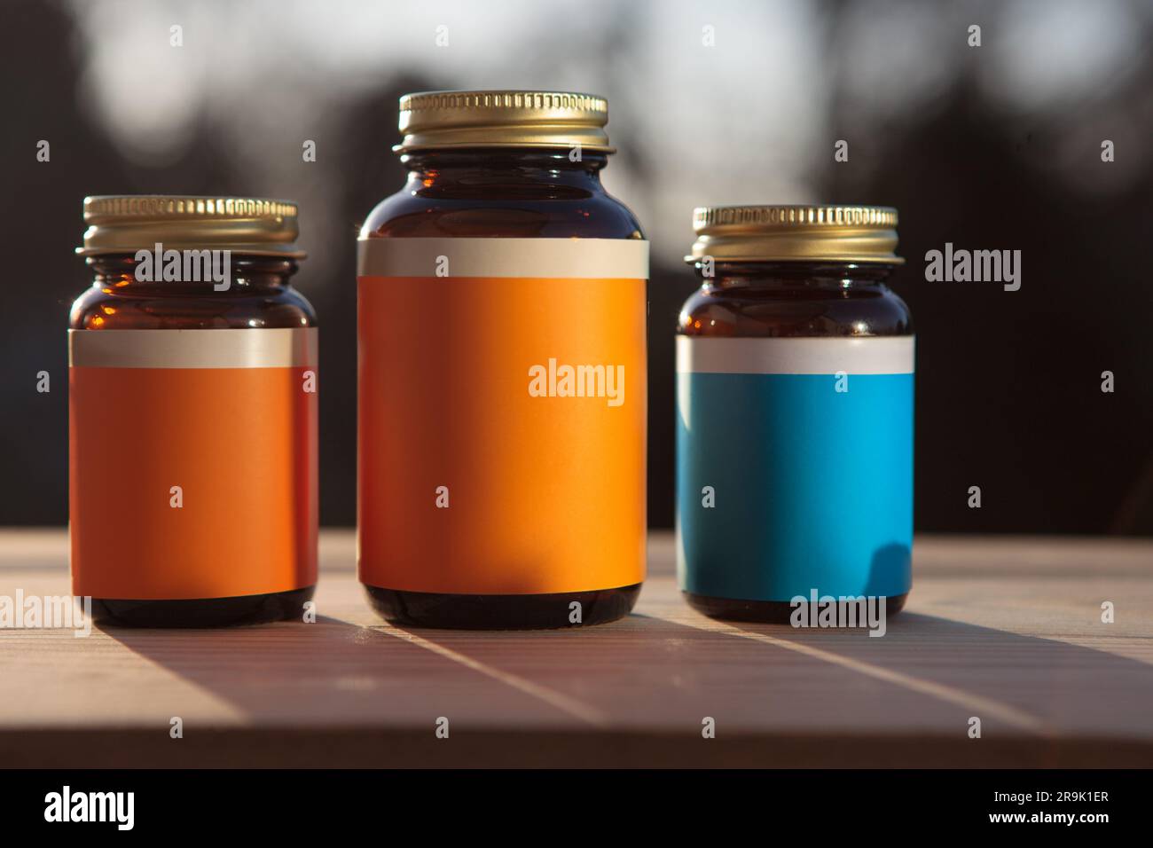 Group of medicine containers on the table, natural light. Mockup, empty ...