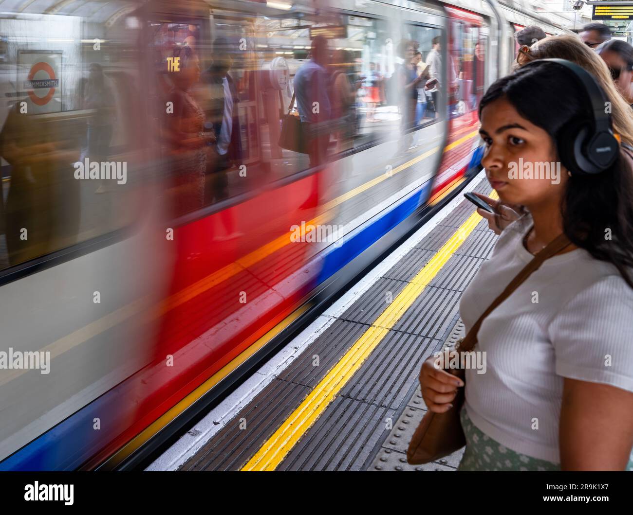 Indian woman waiting for an Underground train which is arriving at ...