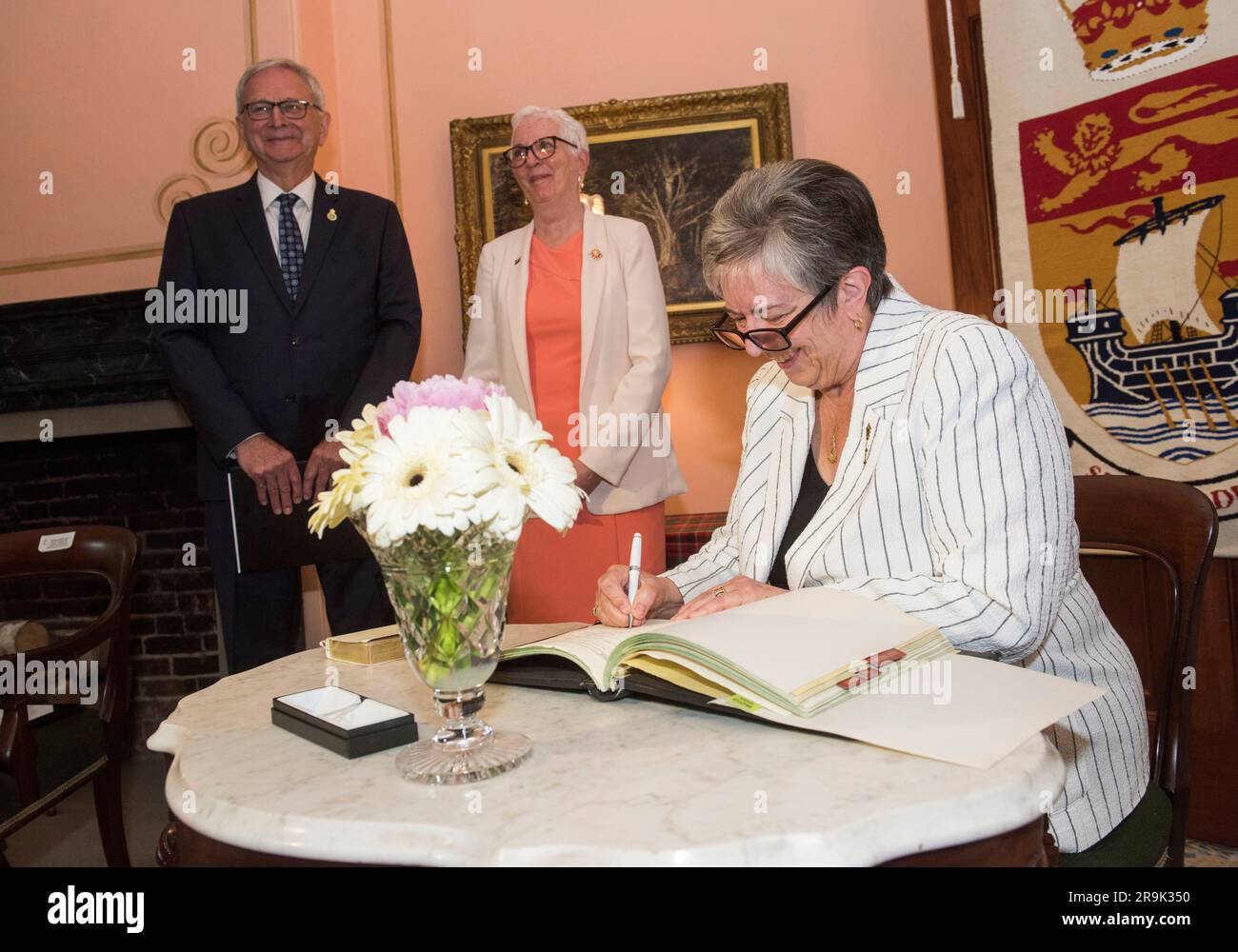 Fredericton, Canada. 27th June, 2023. Kathy Bockus, right, is sworn in ...
