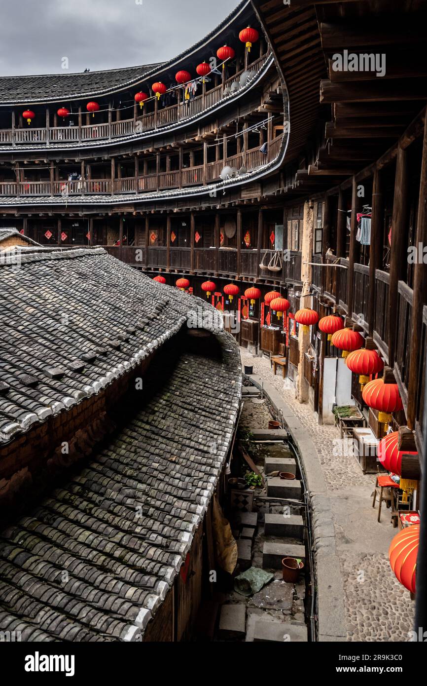 The red lanterns suspended from the walls of Fujian tulou. Longyan City ...