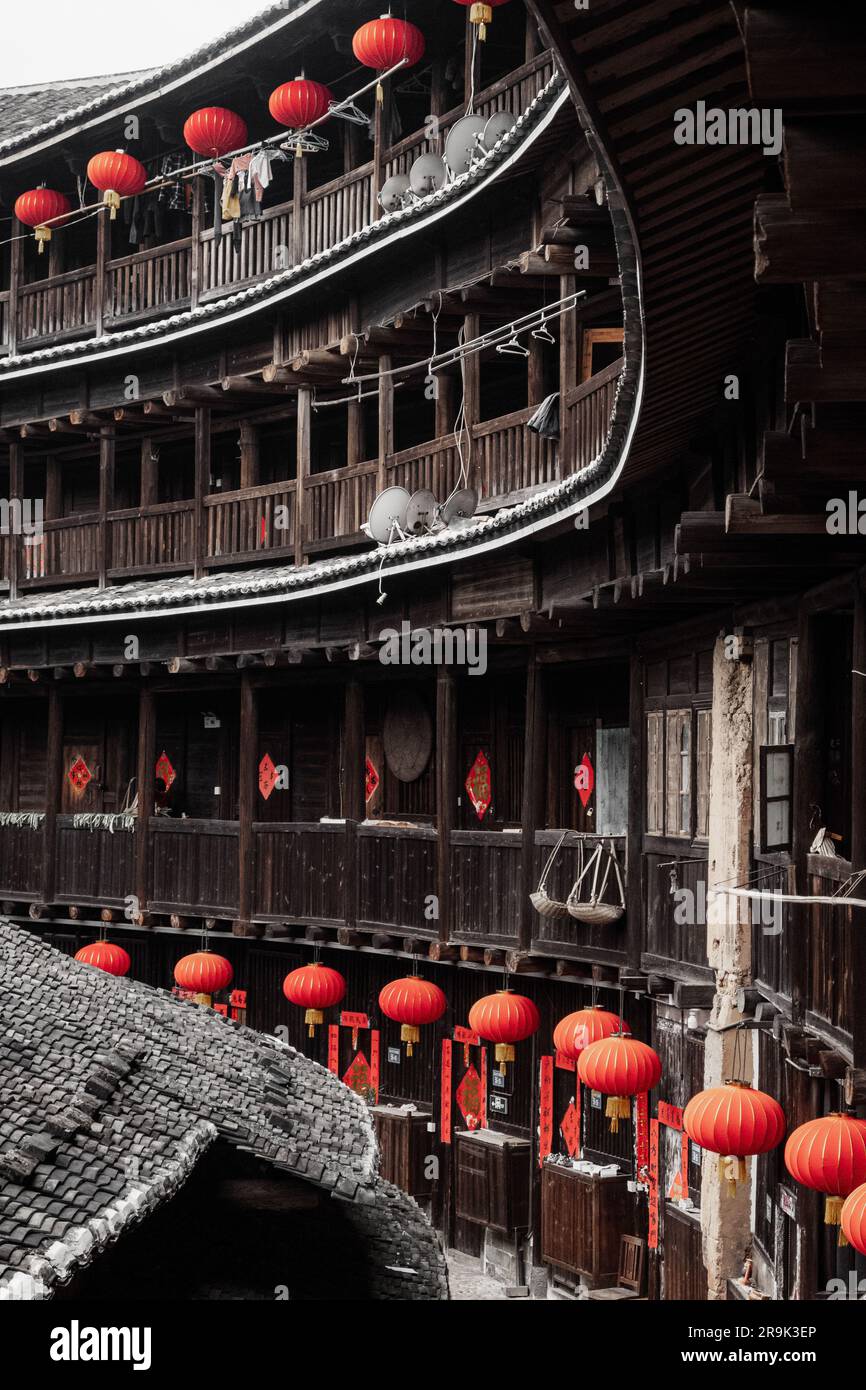 The red lanterns suspended from the walls of Fujian tulou. Longyan City ...