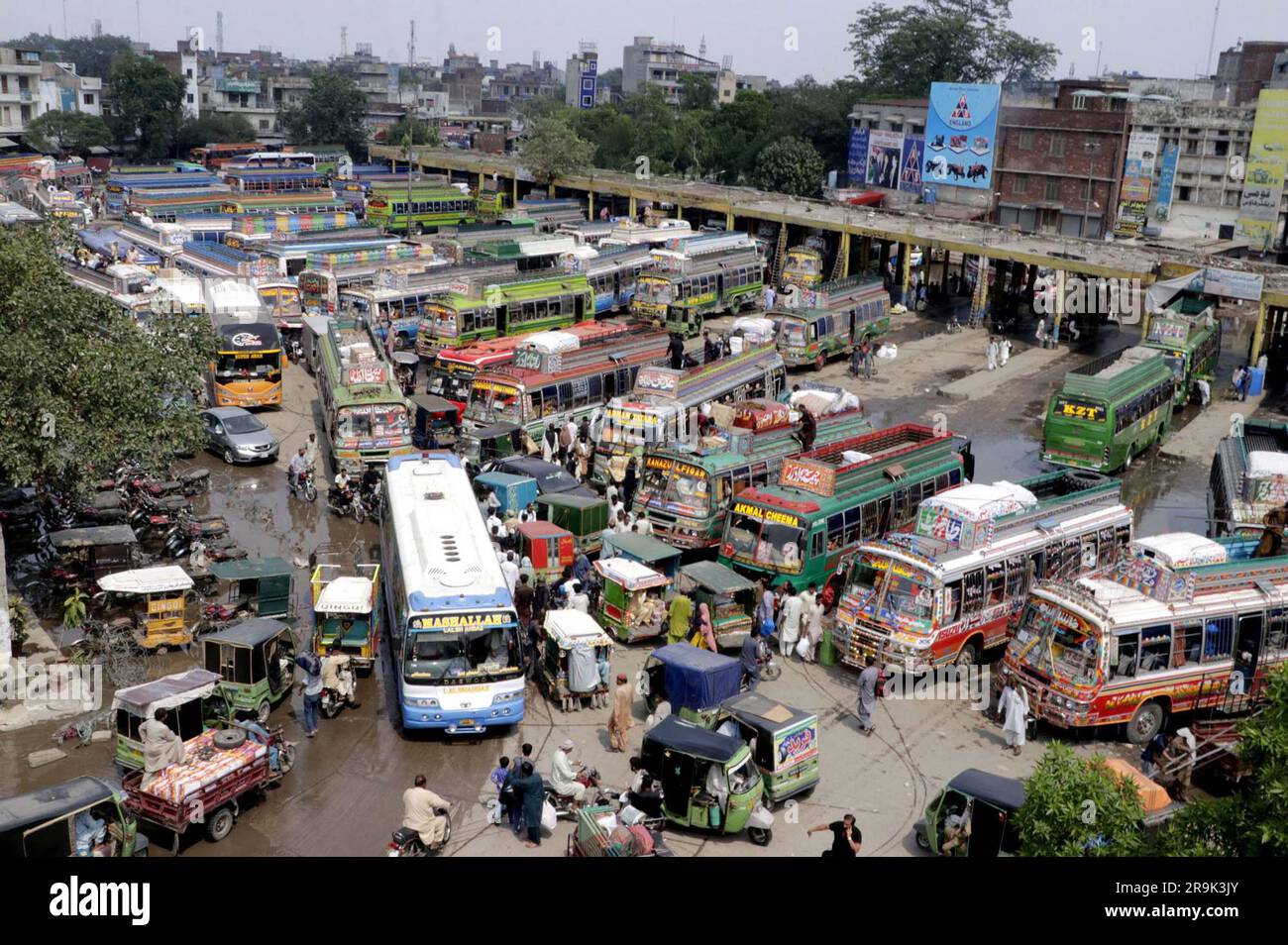 Karachi, Pakistan, June 27, 2023. People to board on bus as they are ...