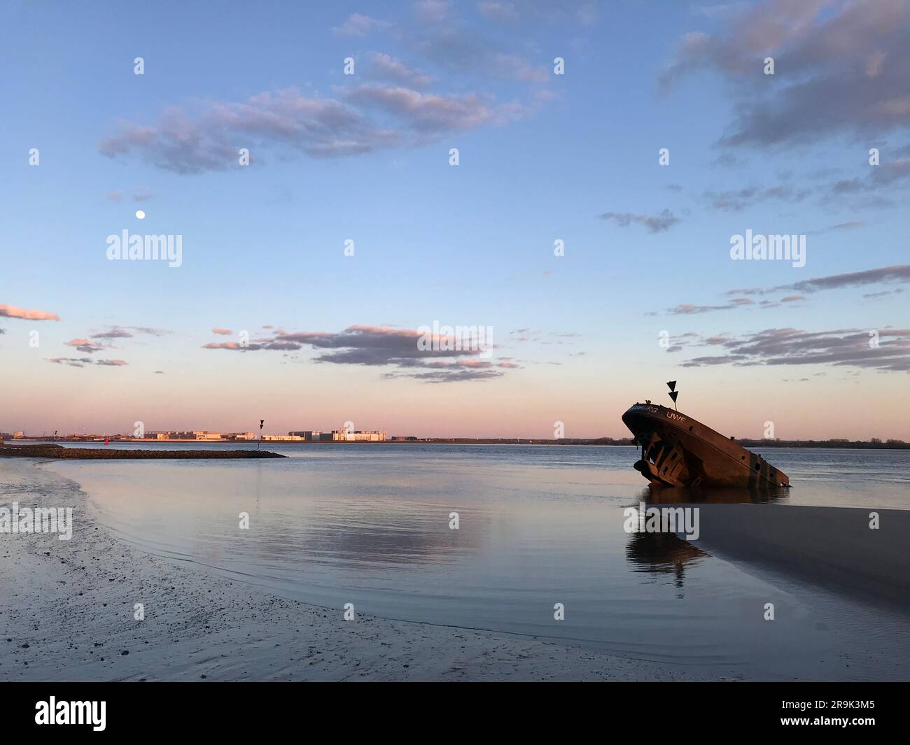 Old, stranded shipwreck on the beach. Close-up of an ancient ship ...