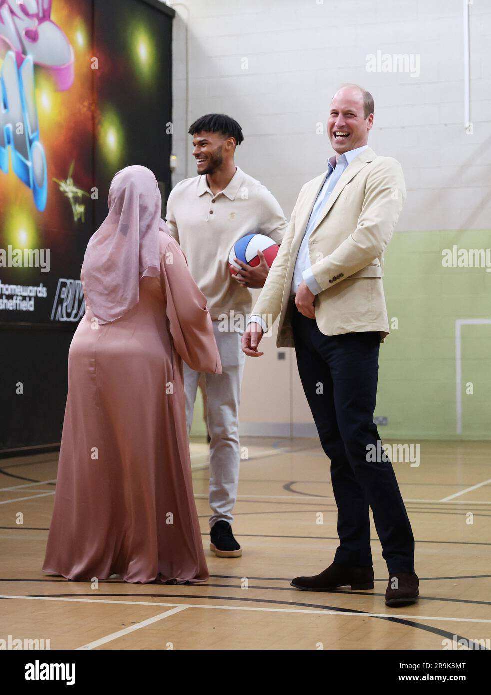 The Prince of Wales speaks to people during a visit to Reach Up Youth ...