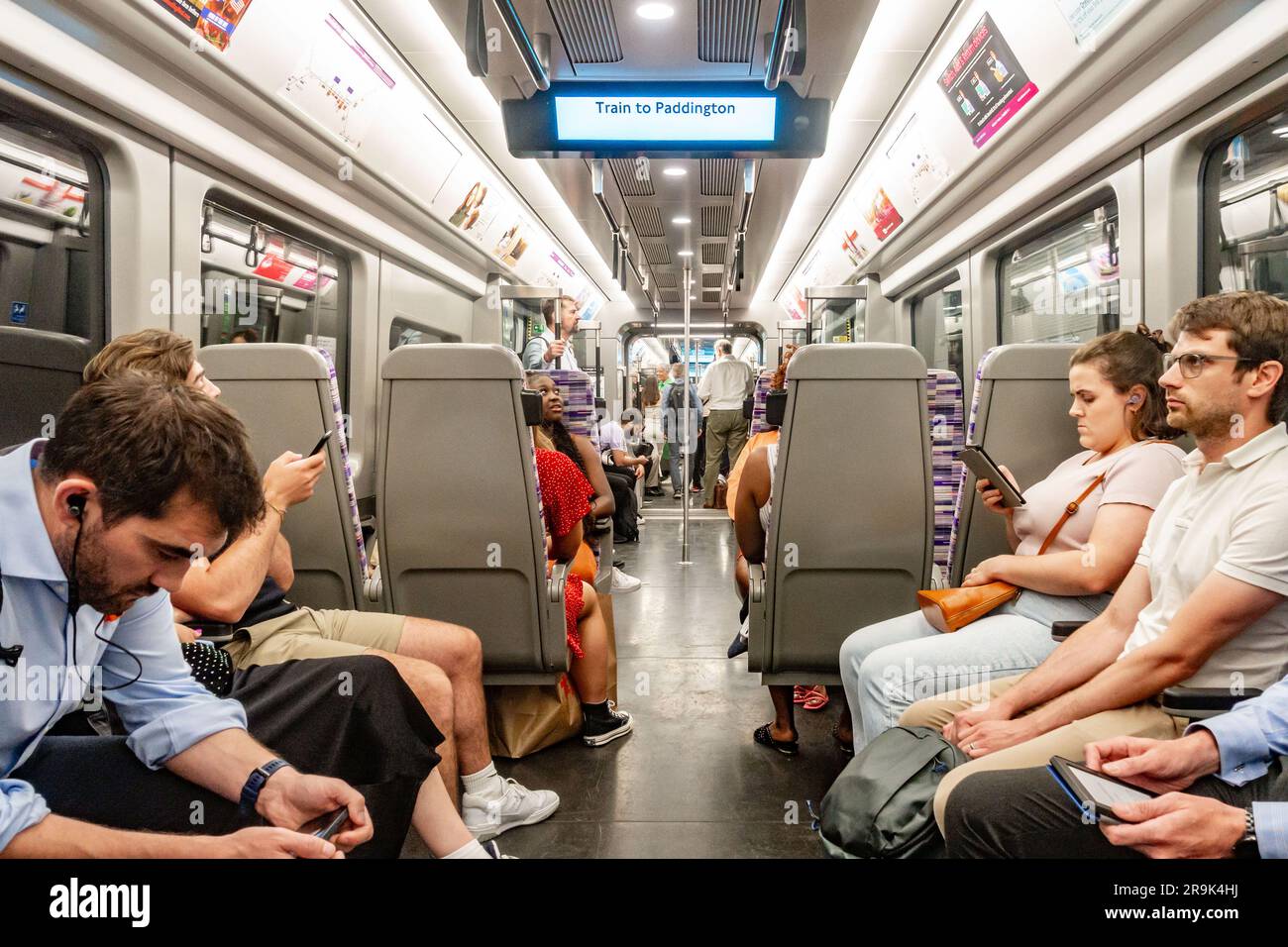 Passengers on an Elizabeth Line London Underground train heading to ...