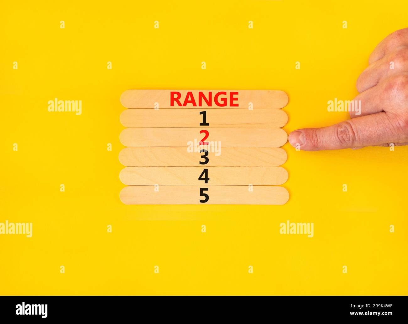 Time to range 2 symbol. Concept word Range 1 2 3 4 5 on wooden sticks ...