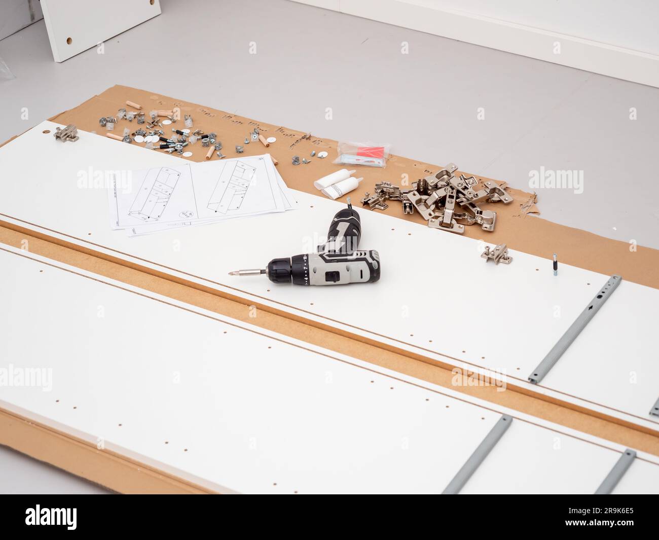 Assembly of furniture and tools for self-assembly of furniture on the ...