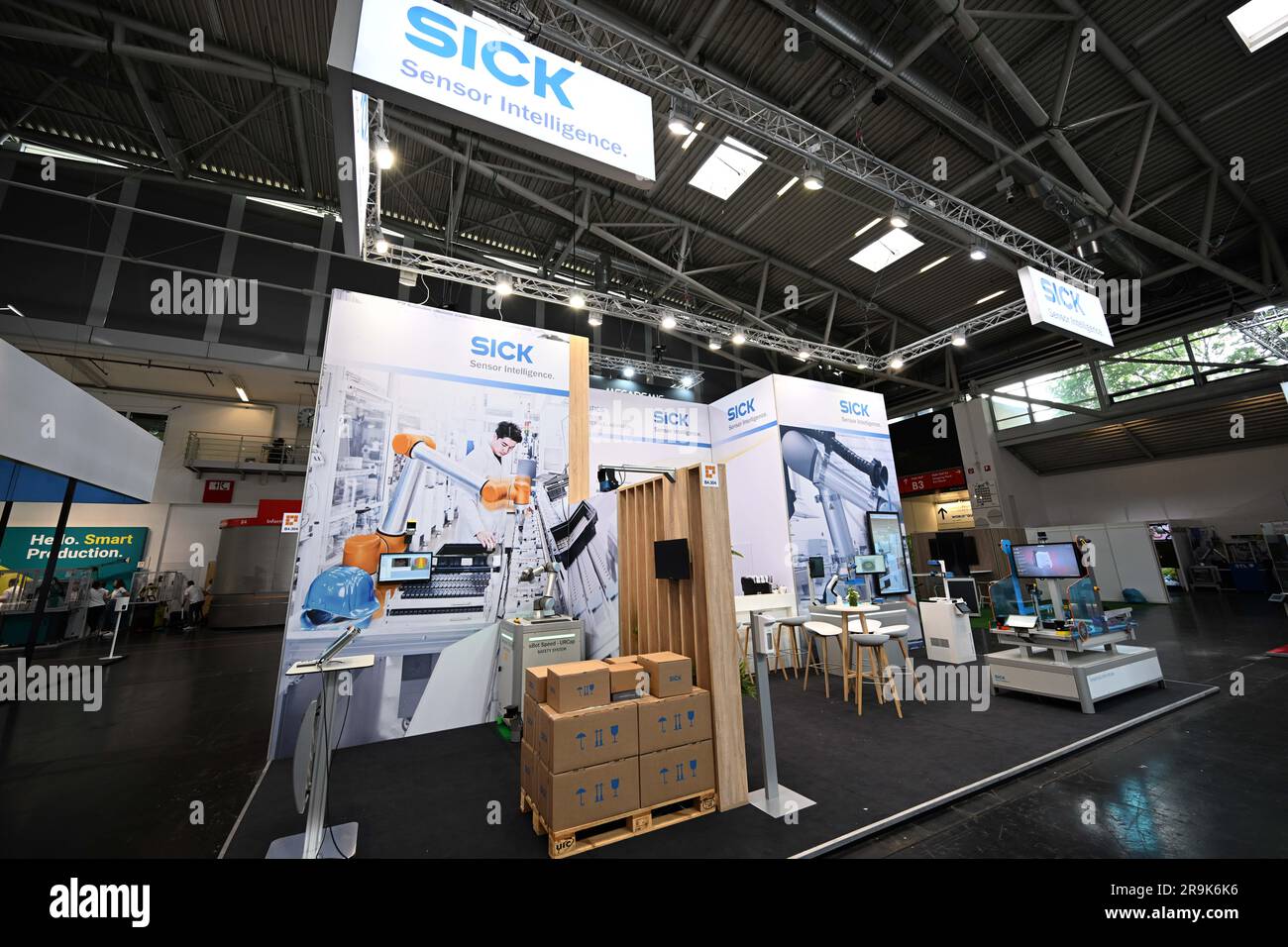 Munich, Germany. 27th June, 2023. SICK's booth can be seen at ...