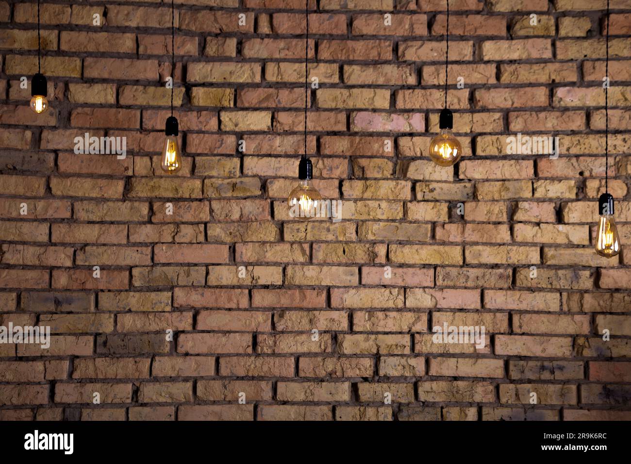Old electric incandescent lamps with tungsten filament. Against the ...