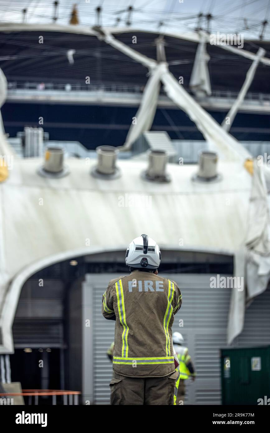 Fireman attend the scene at O2 Arena where the tarpaulin ripped due to ...