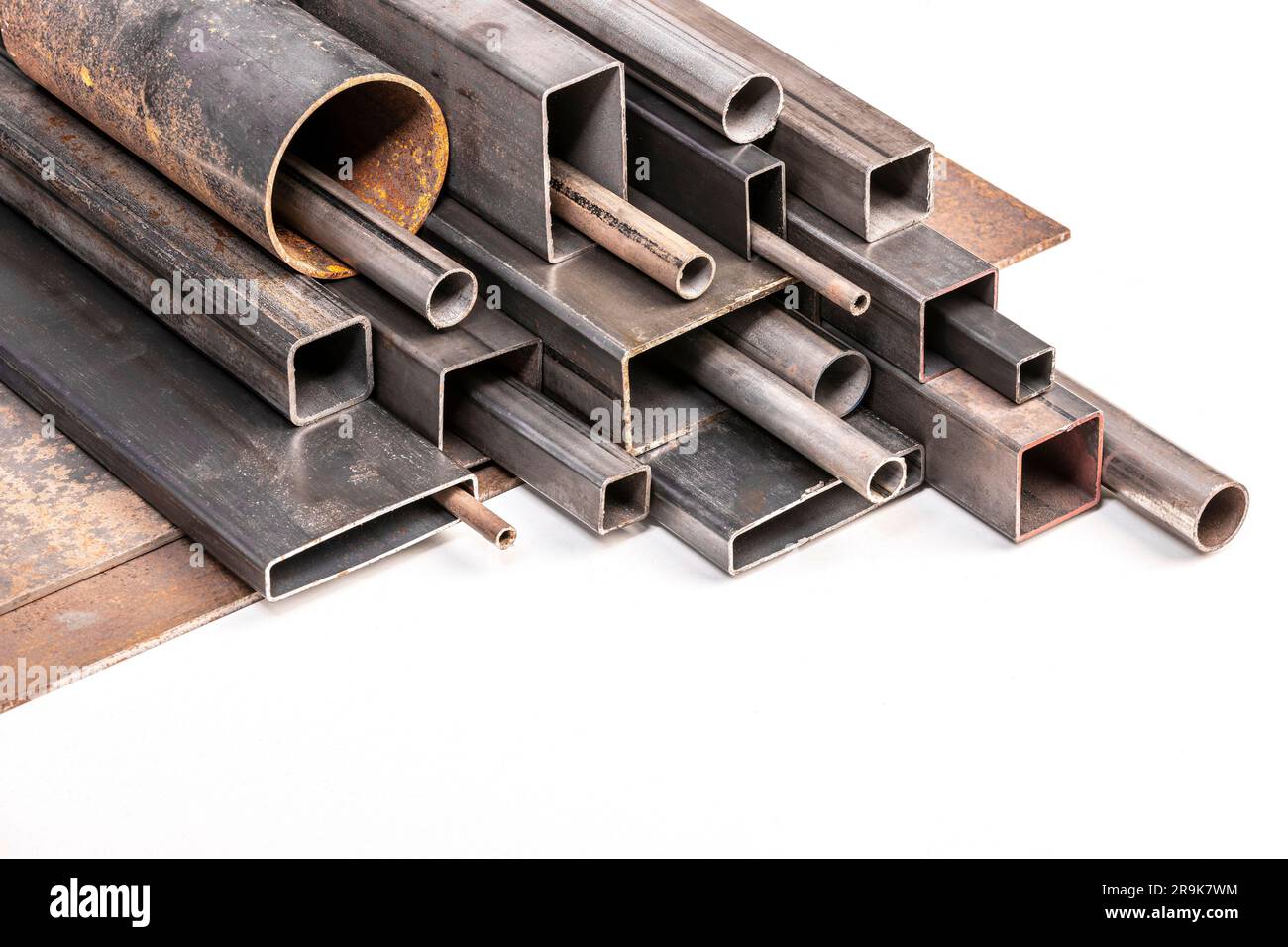 metal profile tubes of different shapes on a white background Stock ...