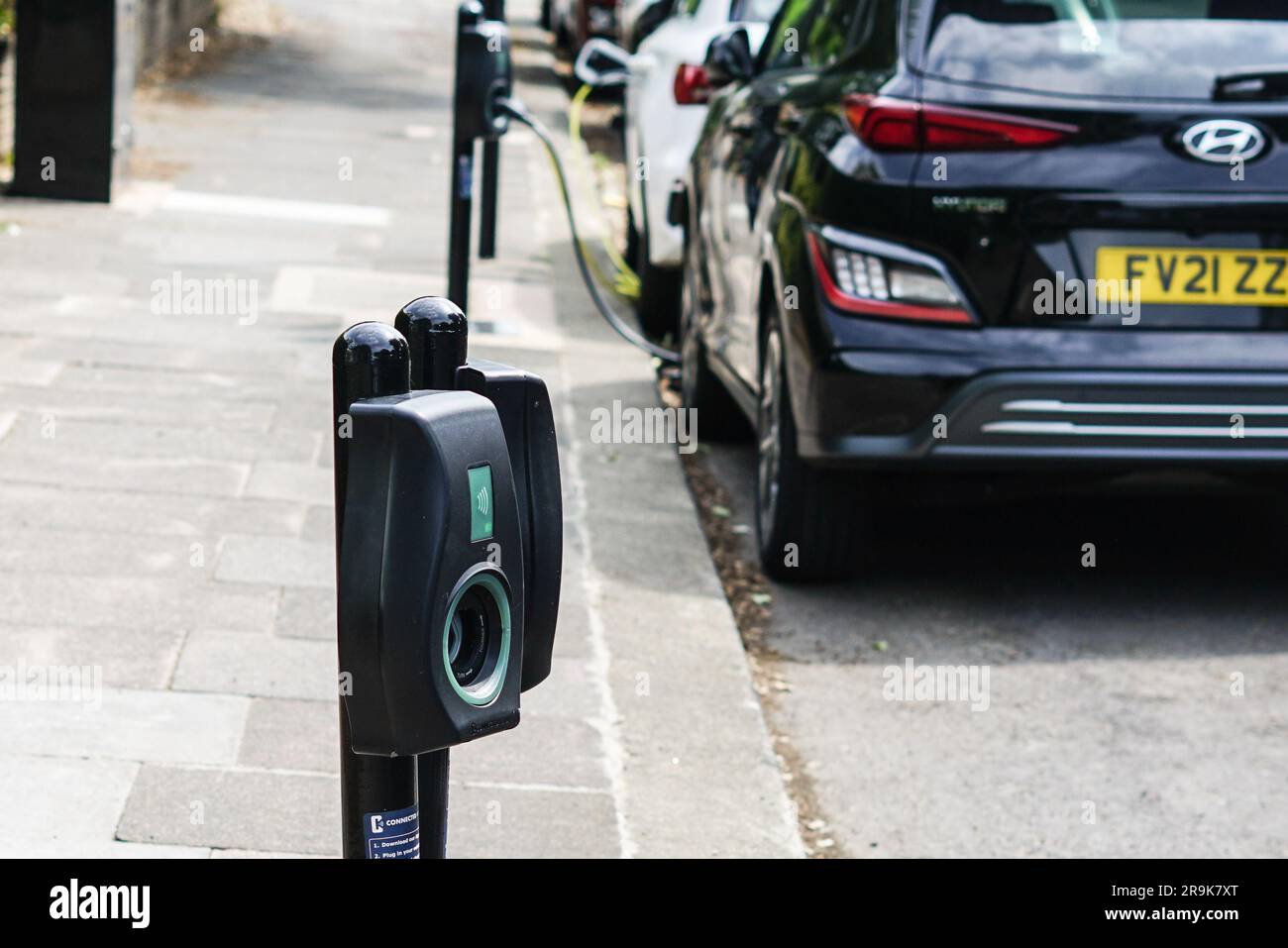 A car is being charged at an electric charging point in Worthing ...