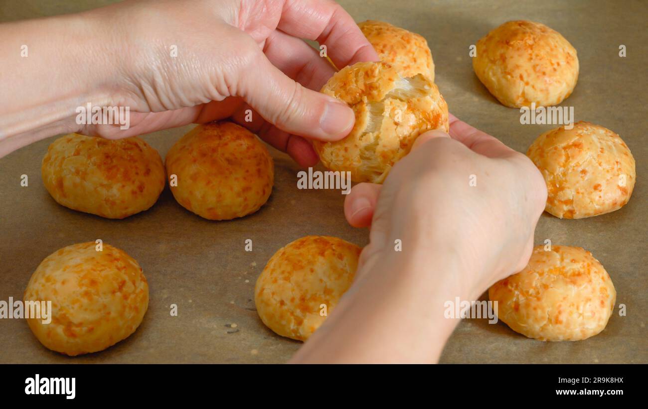 Cheese bread on the baking sheet close-up. Traditional Brazilian cheese ...