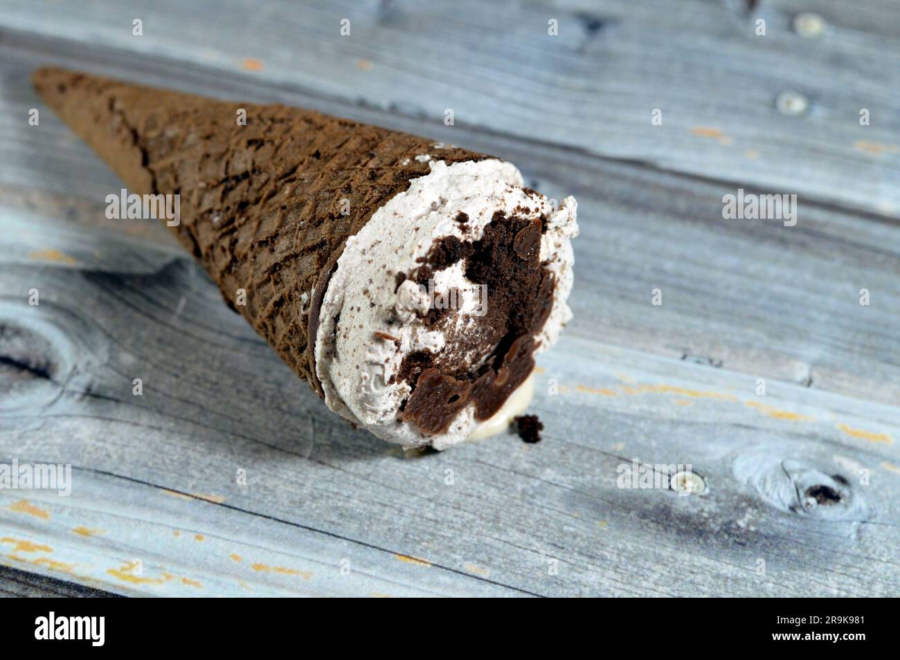 Ice cream of cocoa chocolate and vanilla cone with topping of chocolate ...