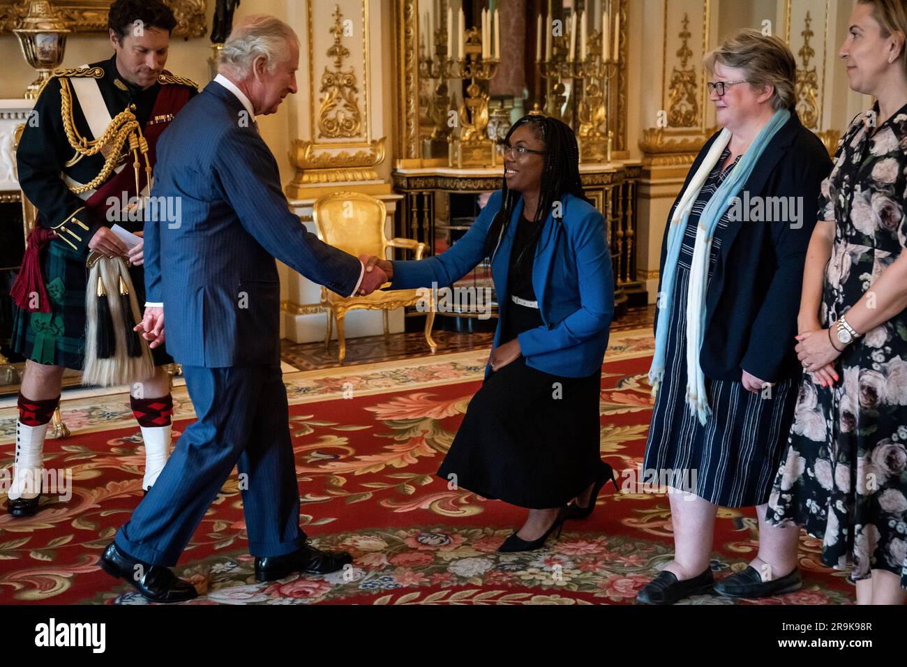 King Charles III greets the Secretary of State for Business and Trade ...