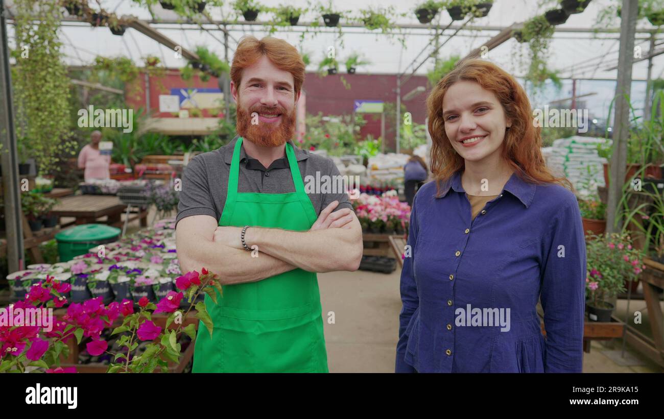 Portrait of Florist and Customer Posing Inside Flower Shop at Local ...