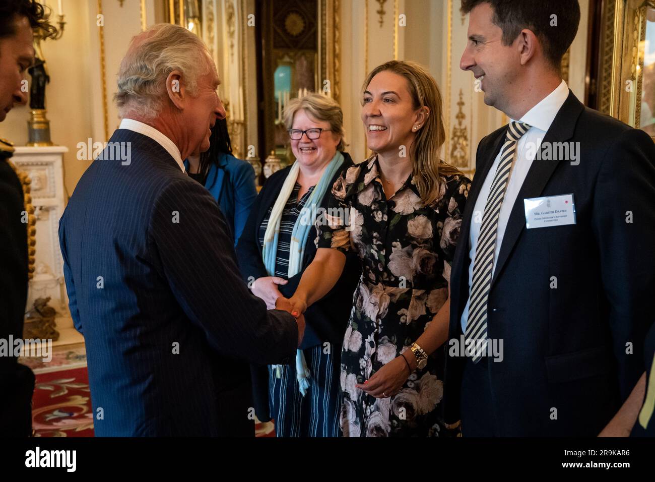 King Charles III greets the Permanent Secretary of the Ministry of ...