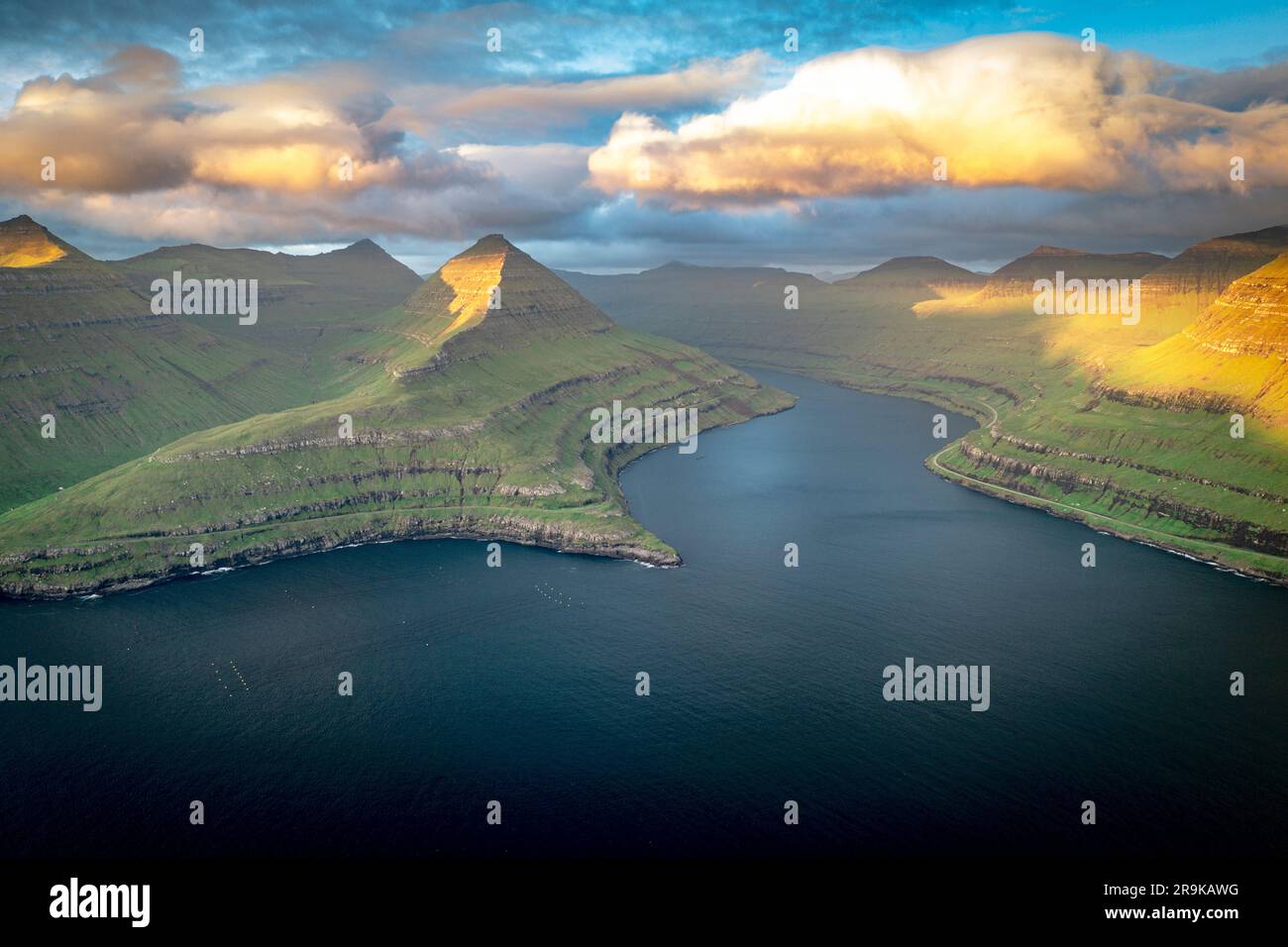 Aerial view of cliffs overlooking Funningur fjord at dawn, Eysturoy ...
