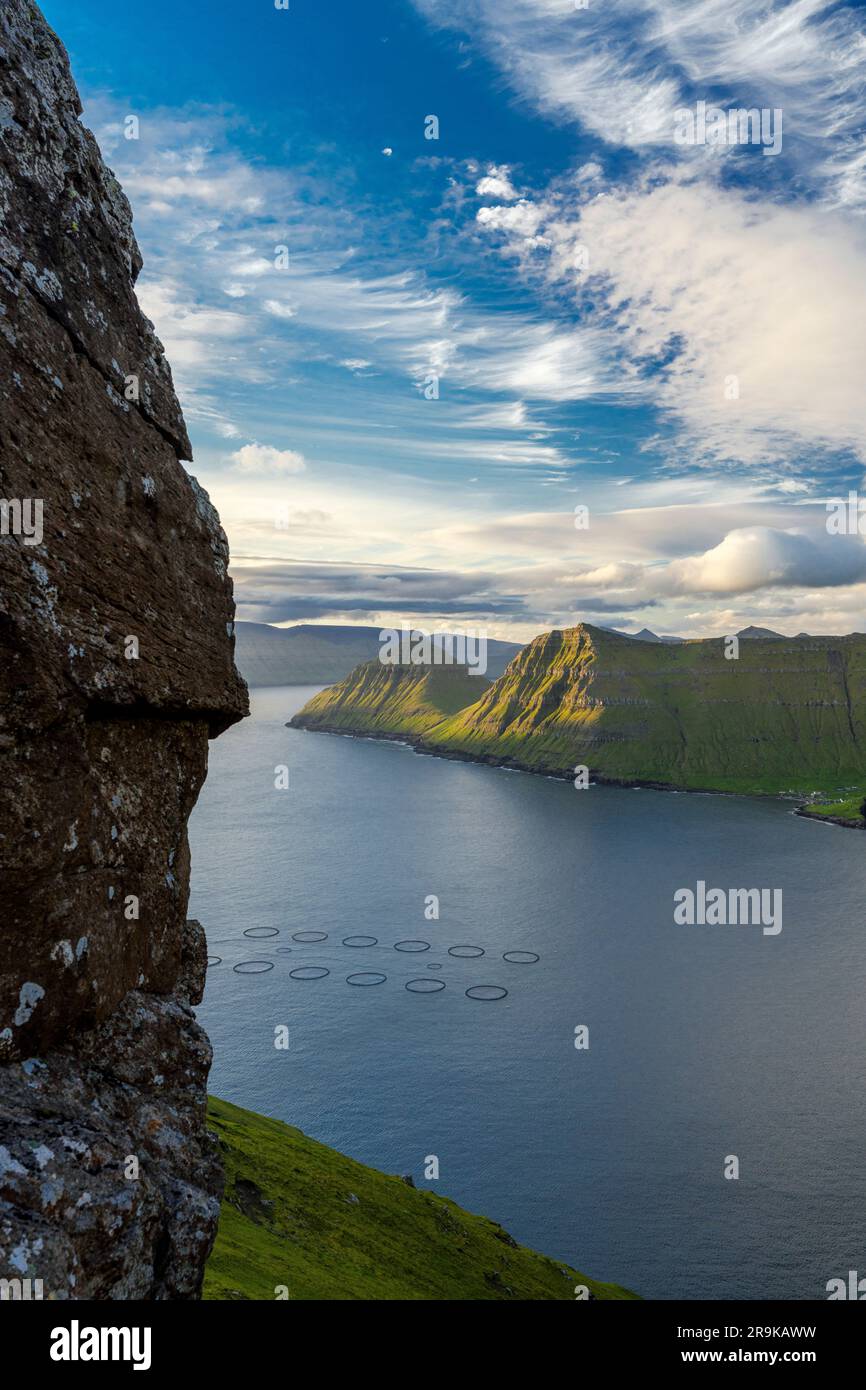 High angle view of fishing tanks in the blue water of a fjord in summer ...