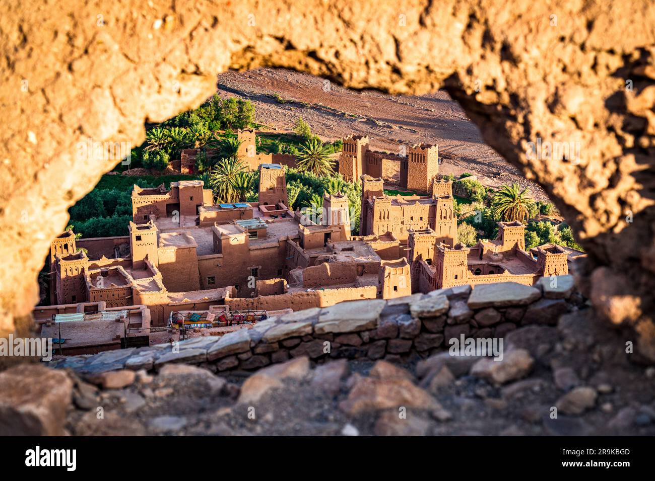 Fortified village of Ait Ben Haddou ksar view through a stone arch at ...