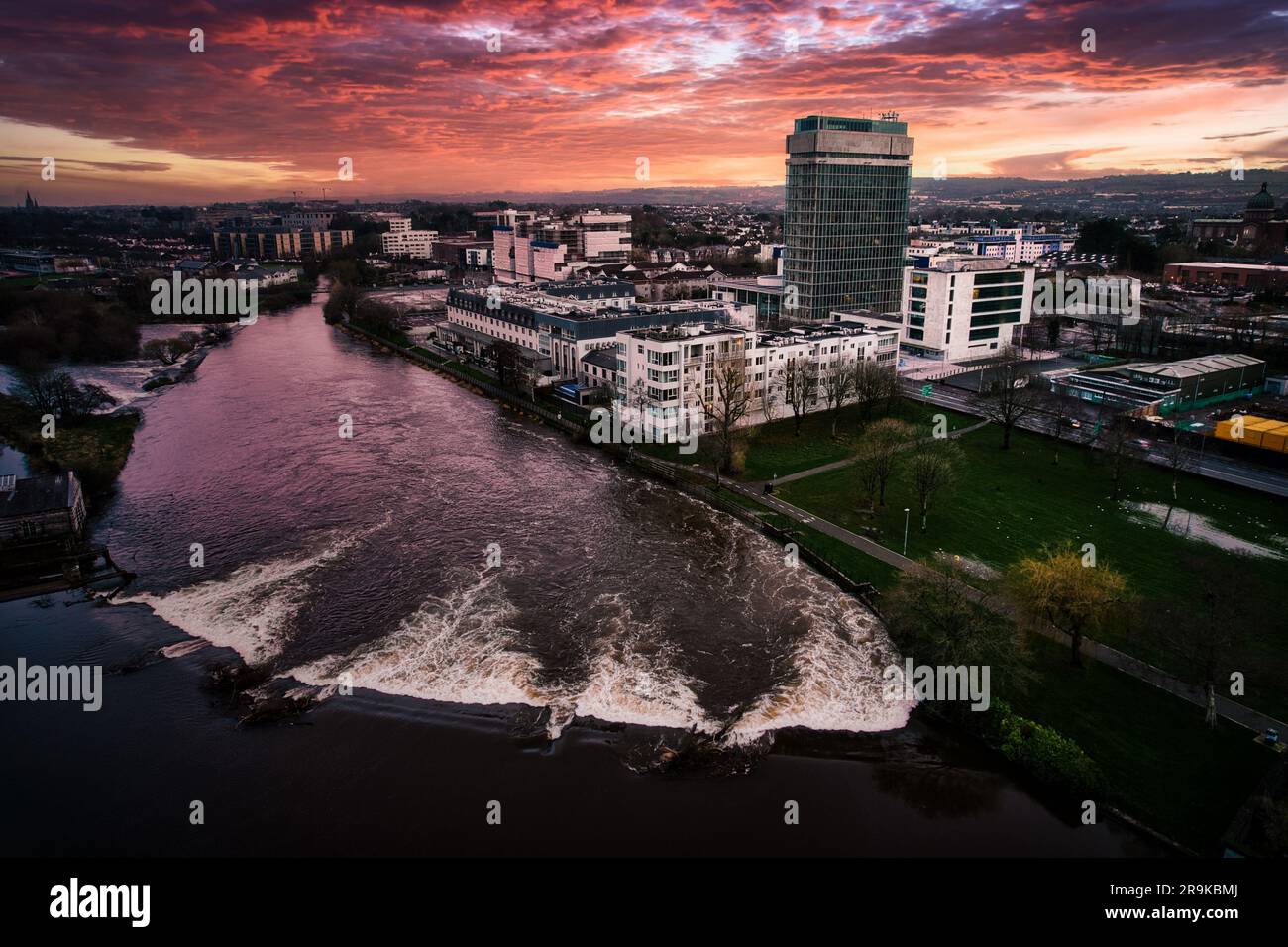 An aerial view of a canal with a vibrant Cork city skyline at a ...