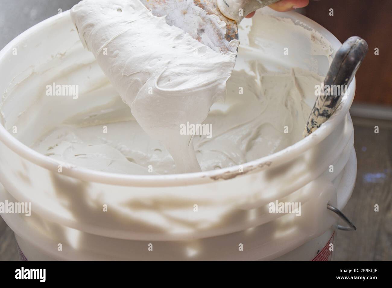 Working with sparkle wall compound spatula human hand construction ...