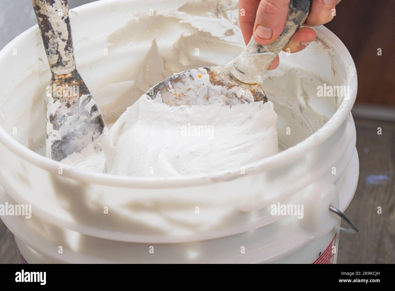 Working with sparkle wall compound spatula human hand construction ...