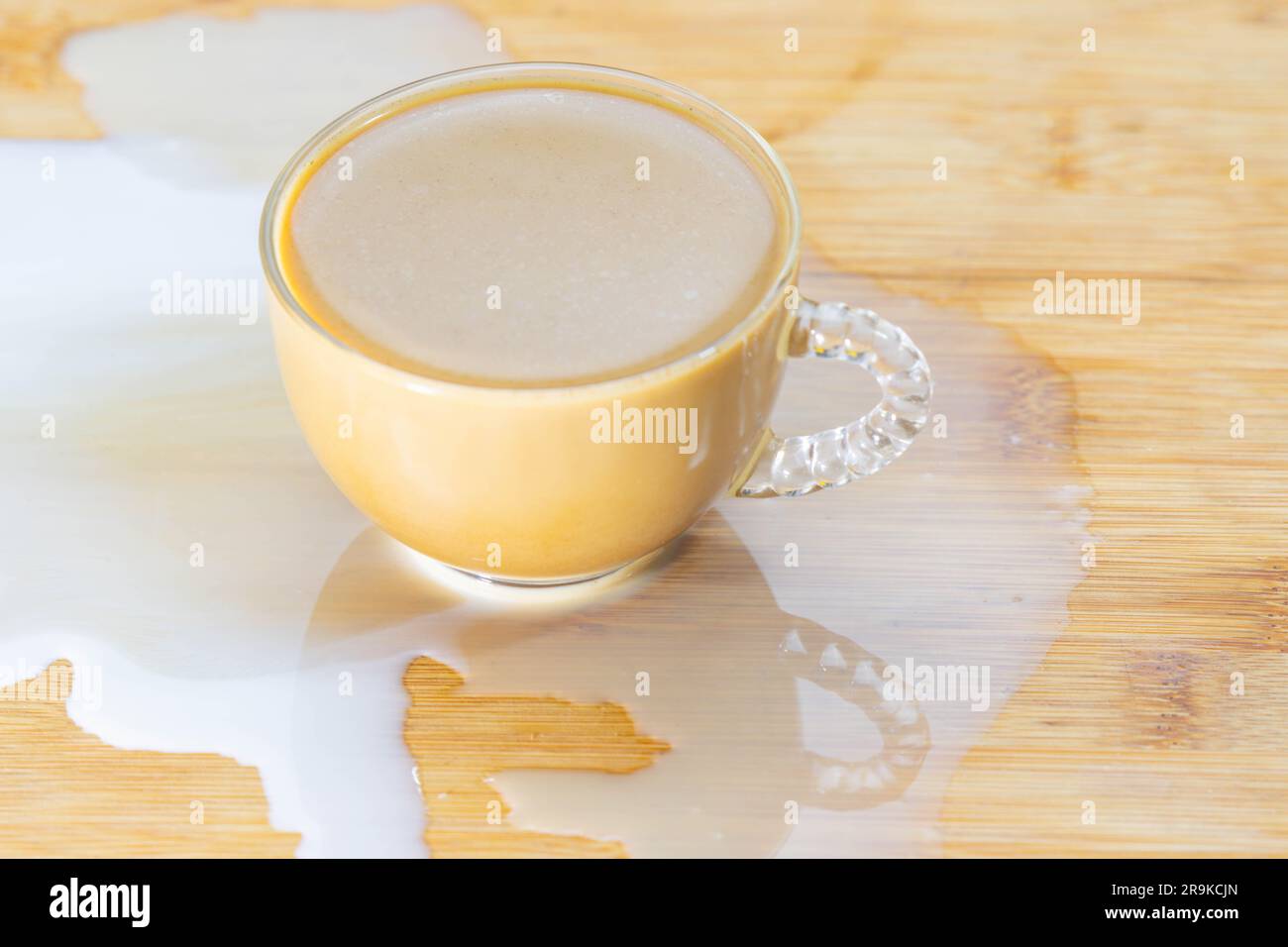 Coffee with cream spilled milk disaster concept Stock Photo - Alamy