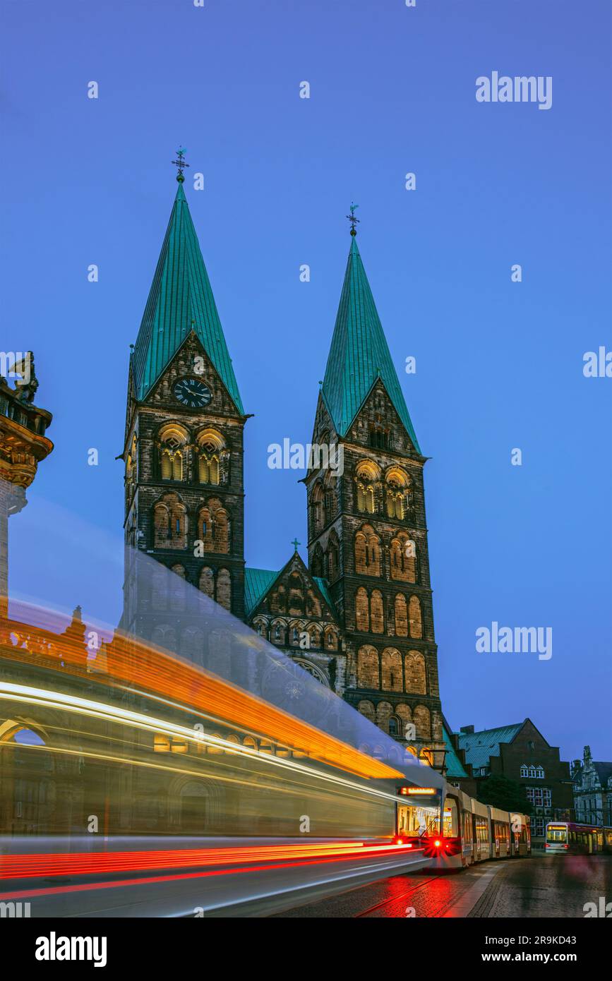 Bremen Cathedral with light trails from a tram arriving in the station ...
