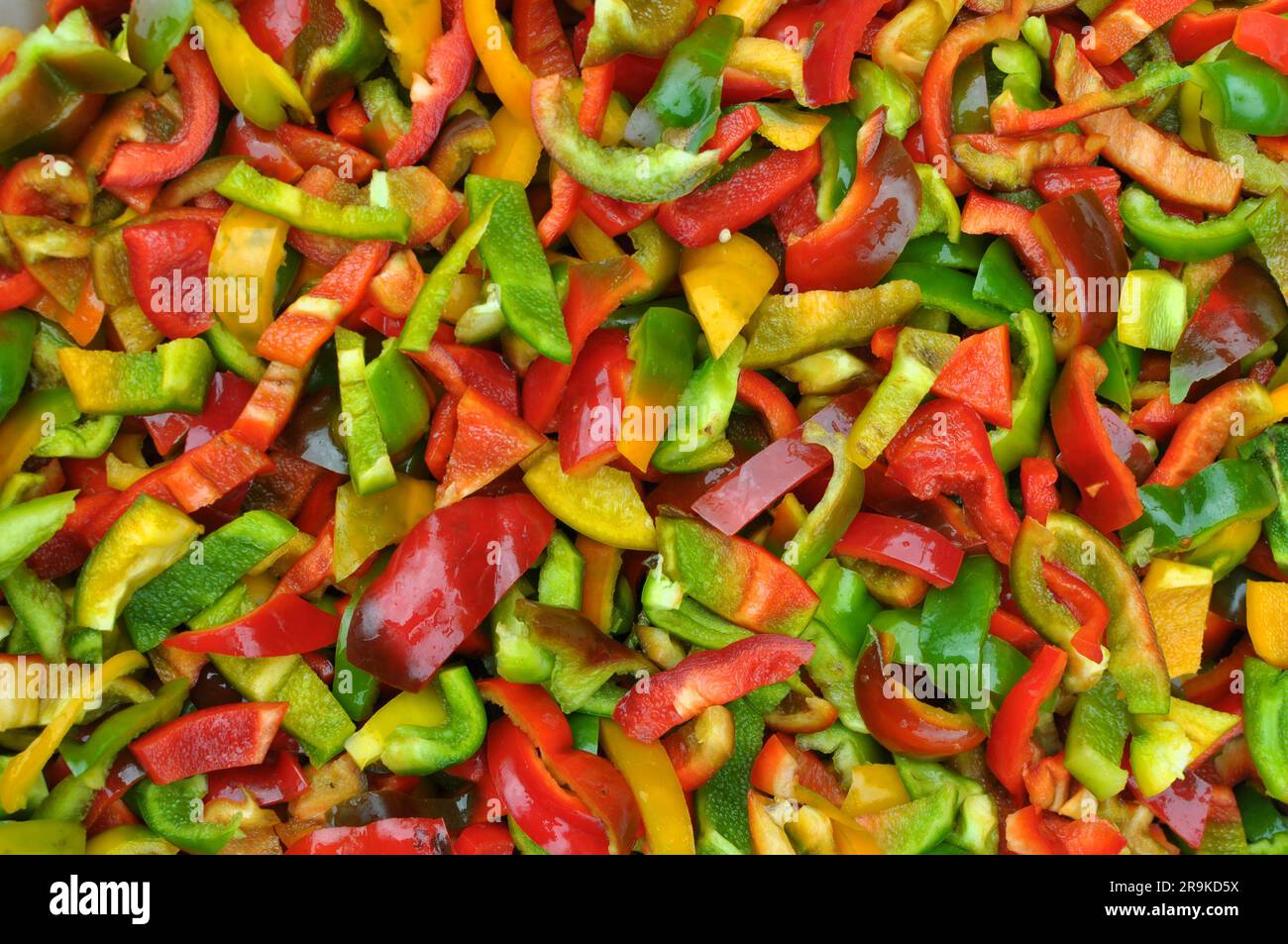 Multicolored vegetable background with chopped bell peppers Stock Photo ...