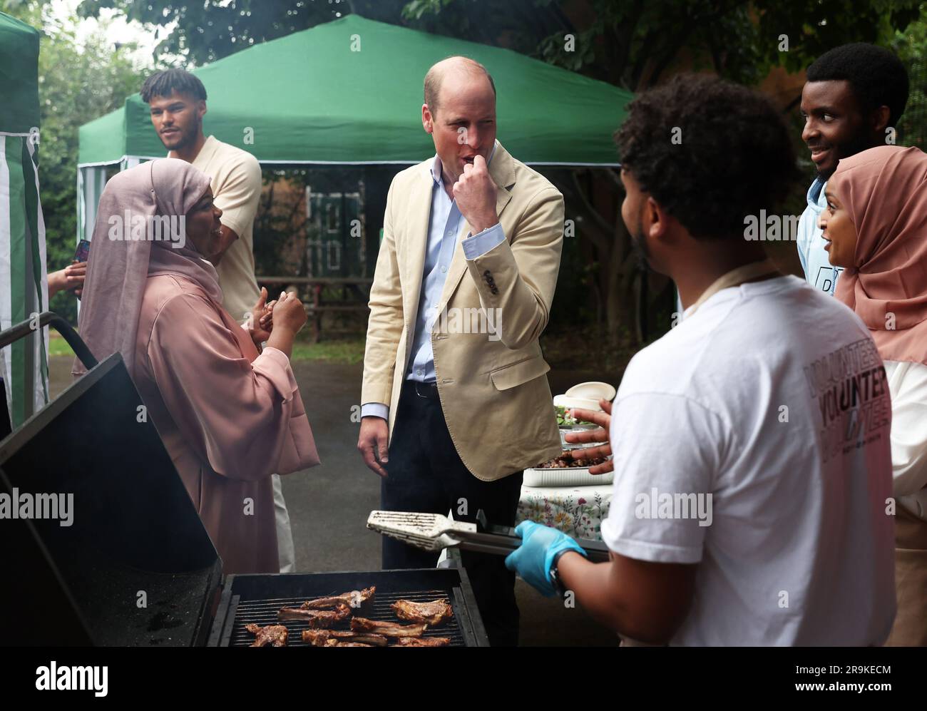 The Prince of Wales with footballer Tyrone Mings (back left) during a ...