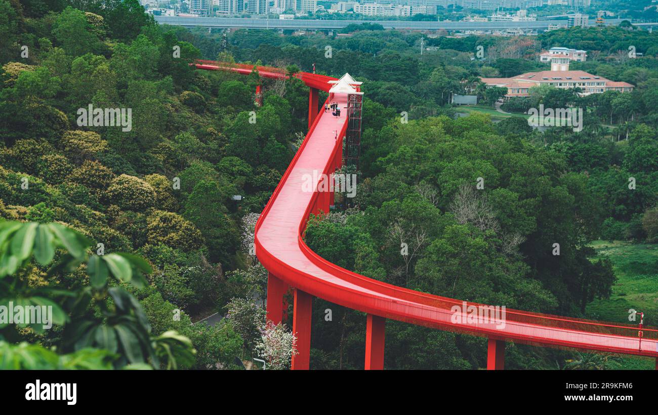 A vibrant red sky trestle bridge stands out in the background of ...