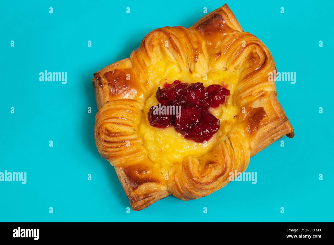 puff with cherry on a white background close-up Stock Photo - Alamy