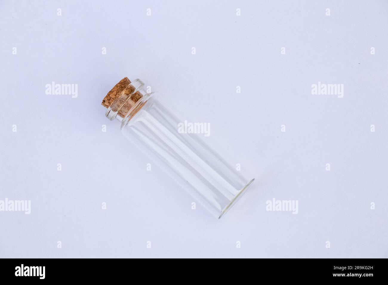 small glass test tube with cork cap on an isolated white Stock Photo ...
